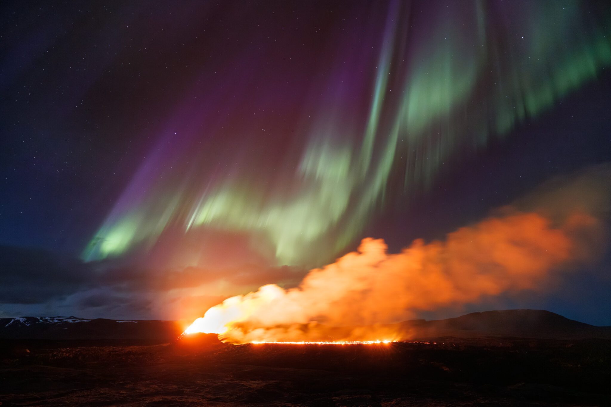 Photographing the Aurora Borealis Above an Eruption (Again)